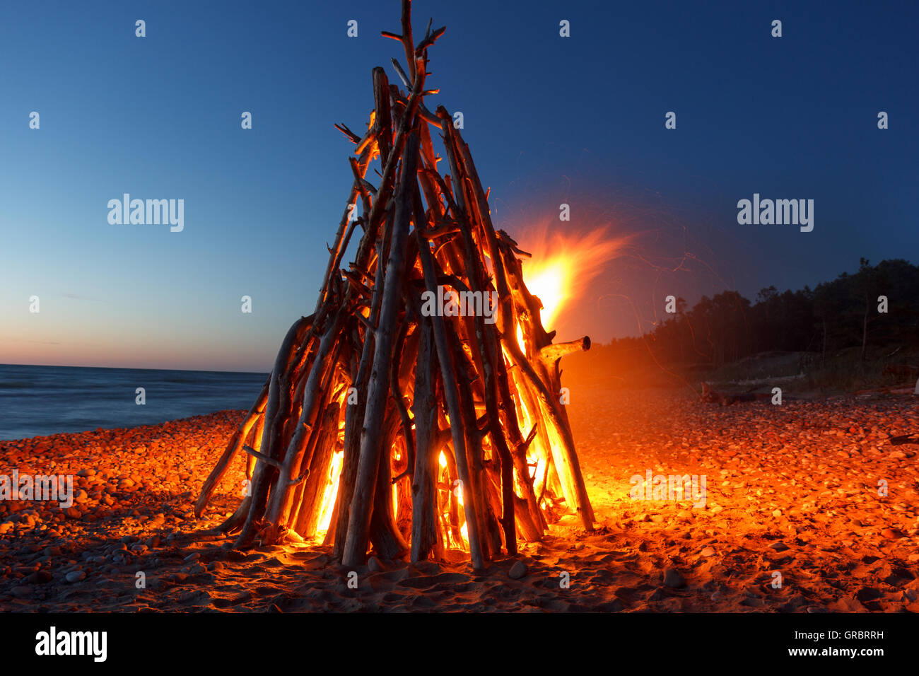 Fire by the sea Stock Photo - Alamy