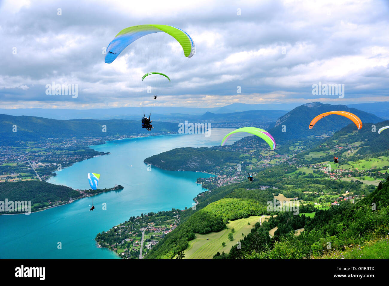 Paragliders Above The Lake Of Annecy, French Alps, France Stock Photo ...