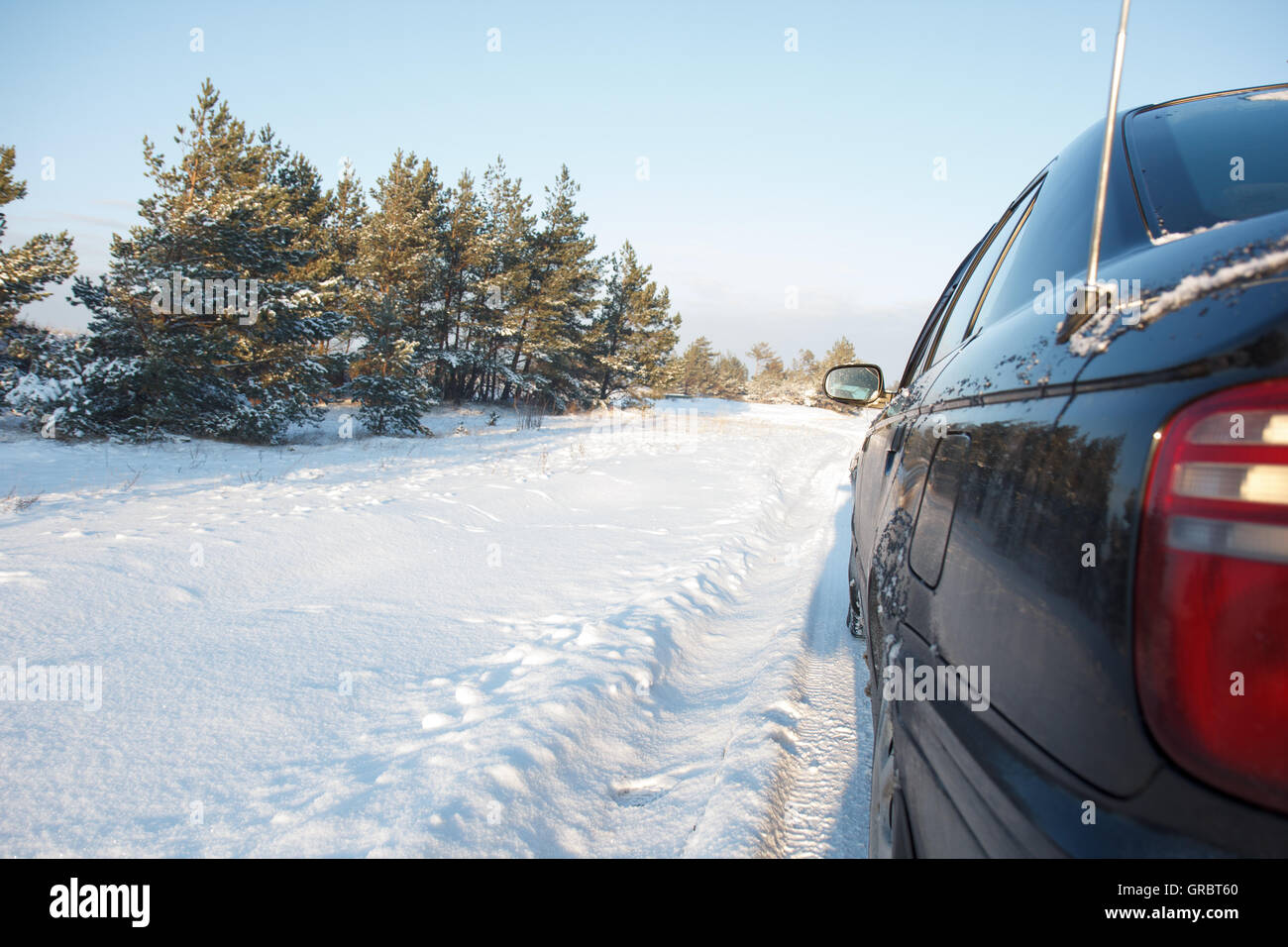 Car on a snowy road Stock Photo - Alamy