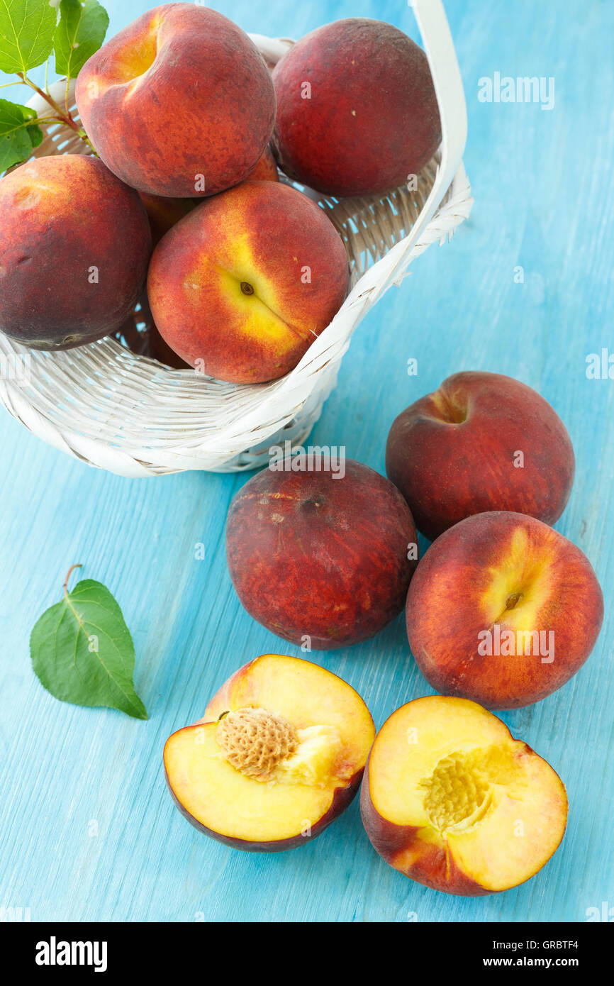 Peach in basket hi-res stock photography and images - Alamy