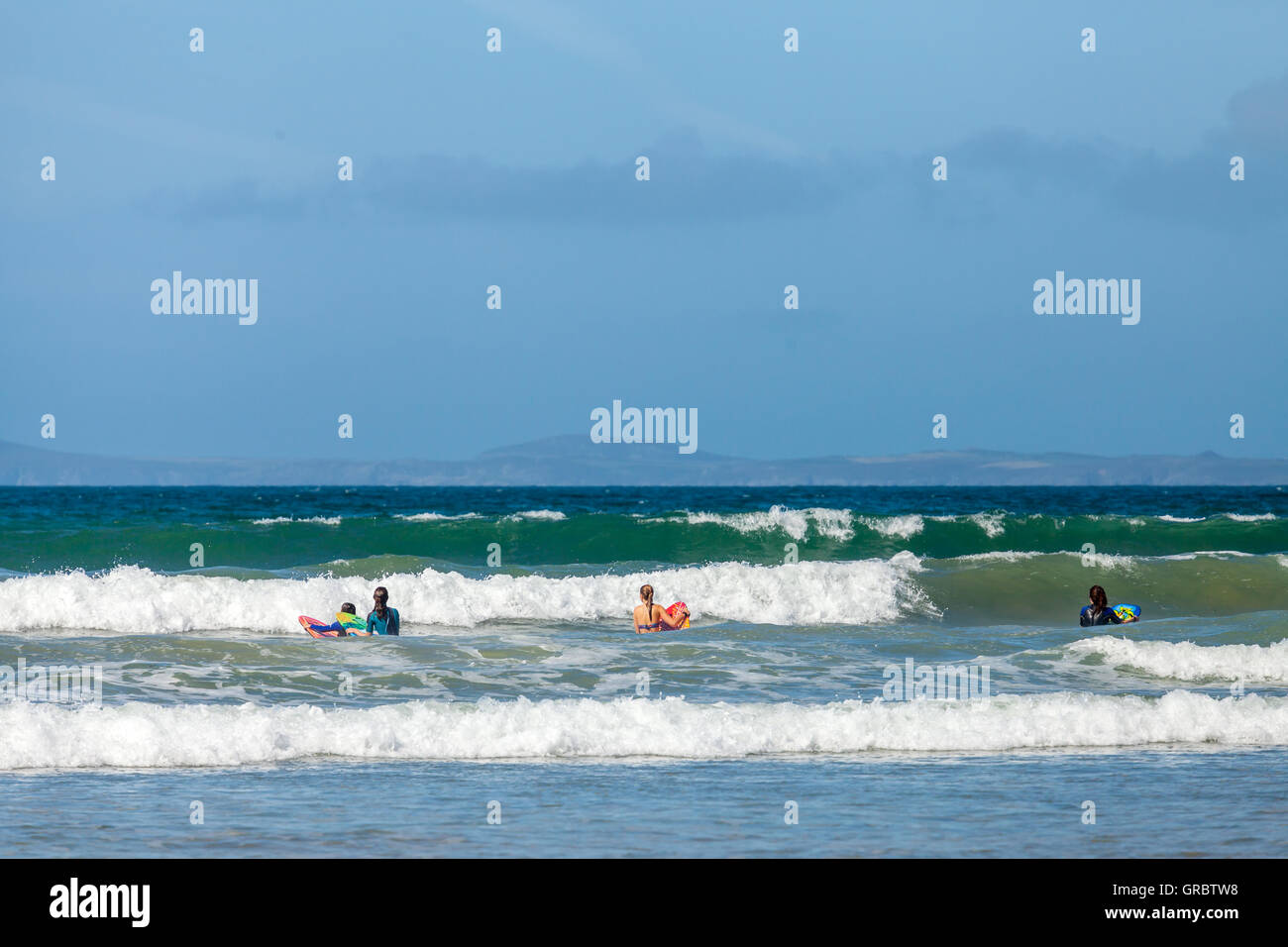 Body boarding on Druidstone Beach in Pembrokeshire Stock Photo - Alamy