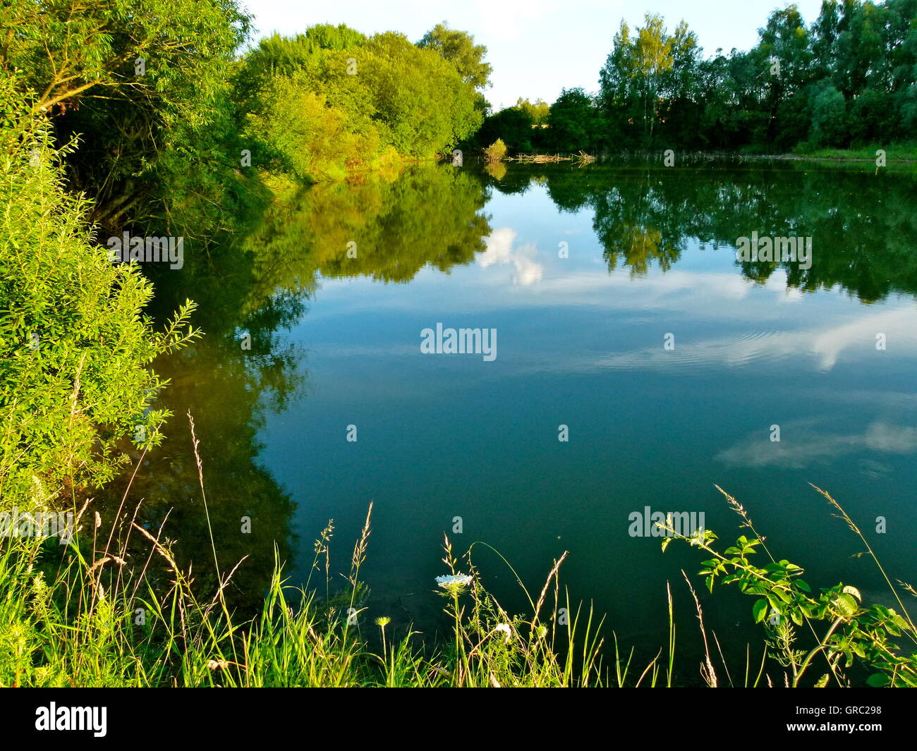 Evening Calm Lake Mirrors Sky Stock Photo - Alamy