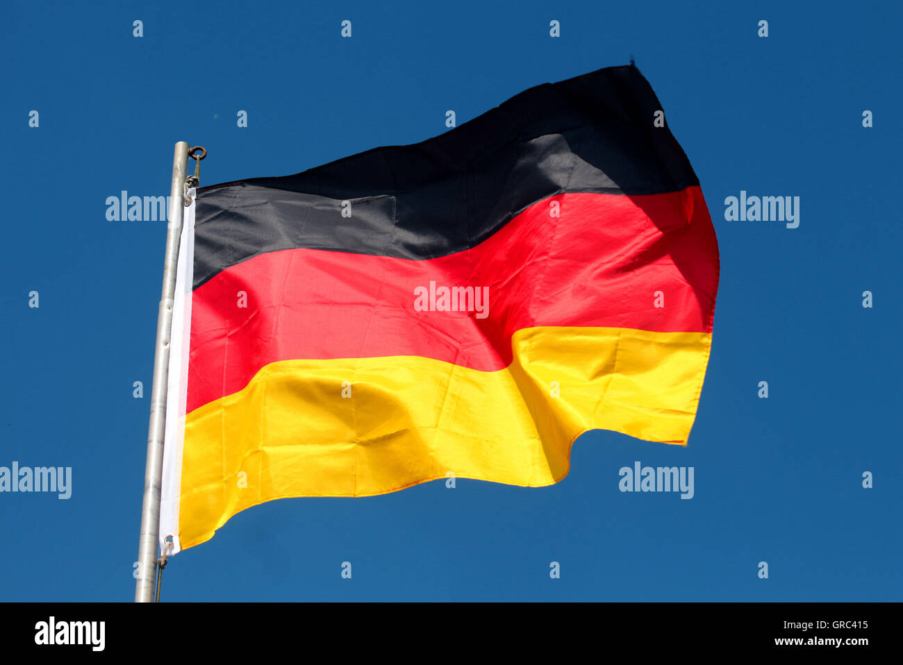 German Flag Waving In The Wind Stock Photo - Alamy