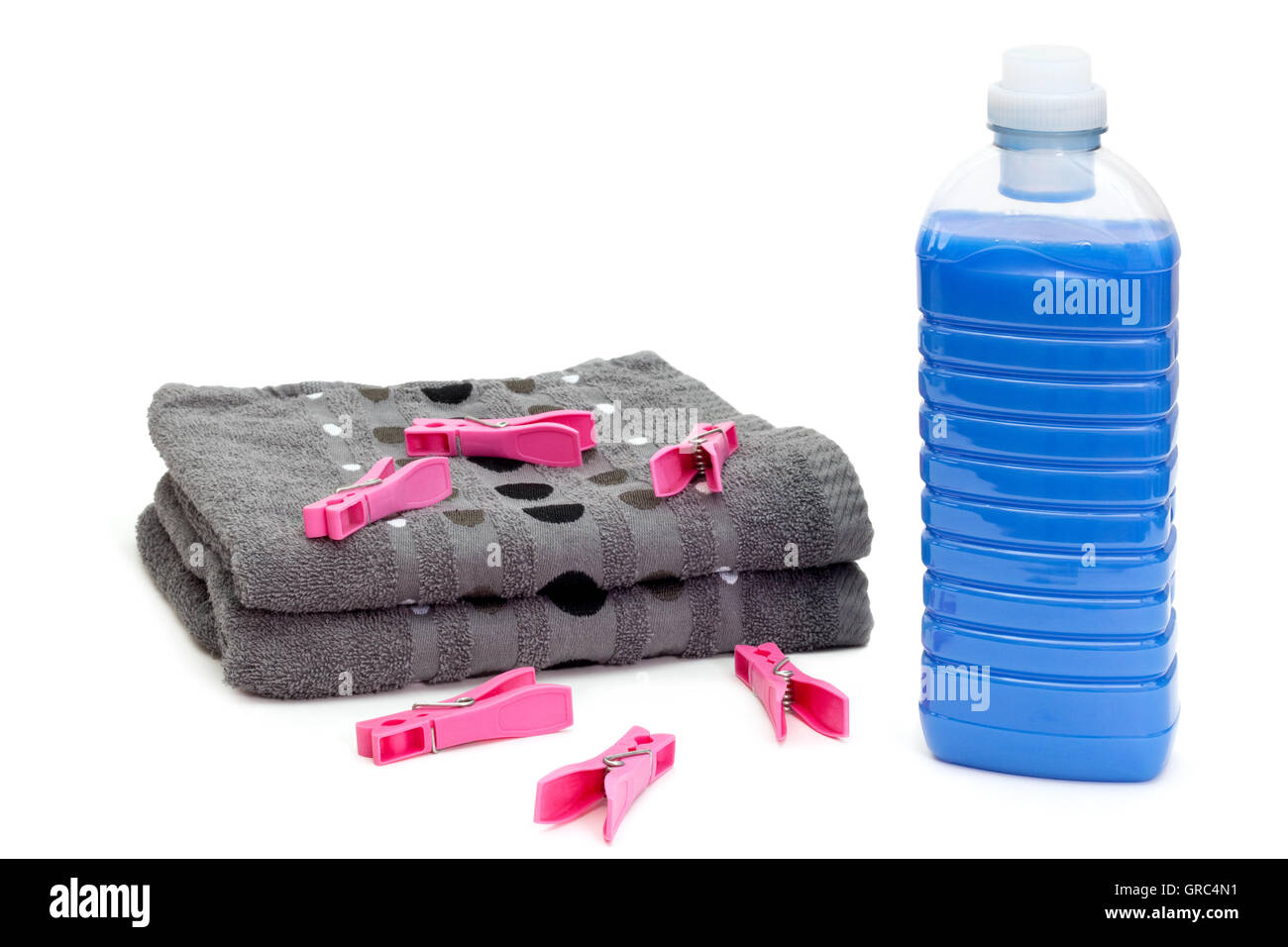 Bottle Of Blue Fabric Softener Near Towels With Clothespins Stock Photo ...