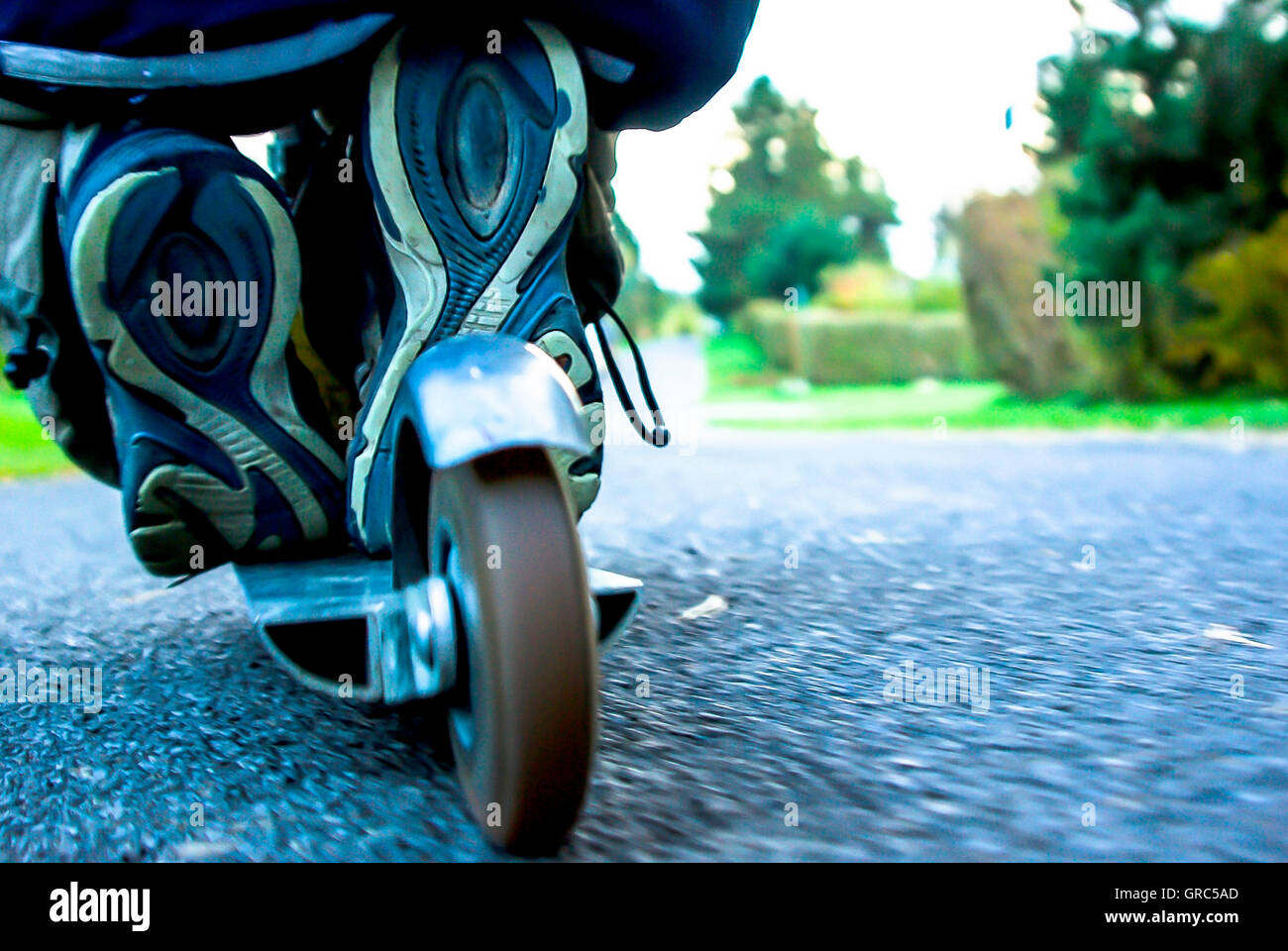Children with kick scooters hi-res stock photography and images - Alamy