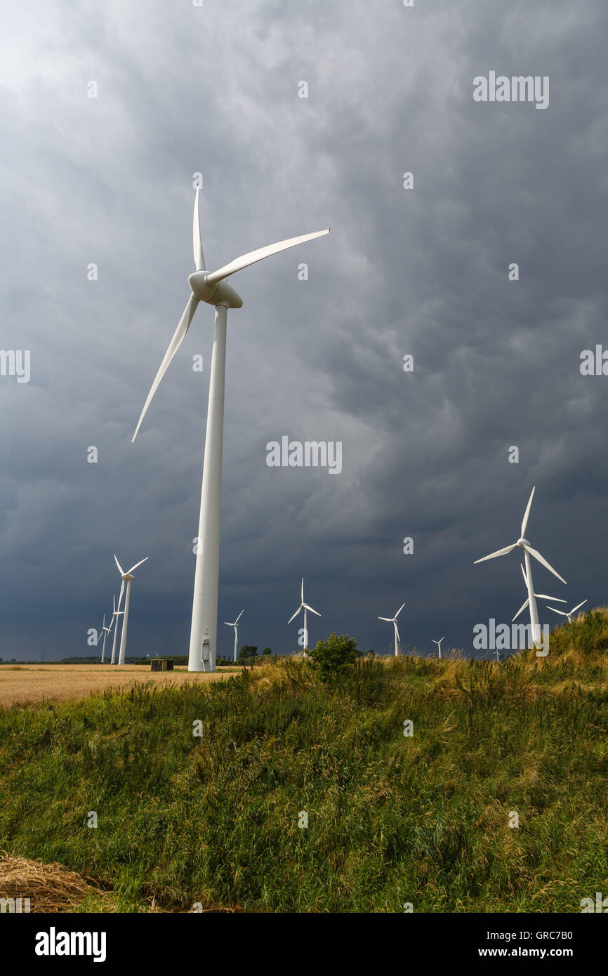 Rain Clouds Over The Wind Turbine Stock Photo - Alamy