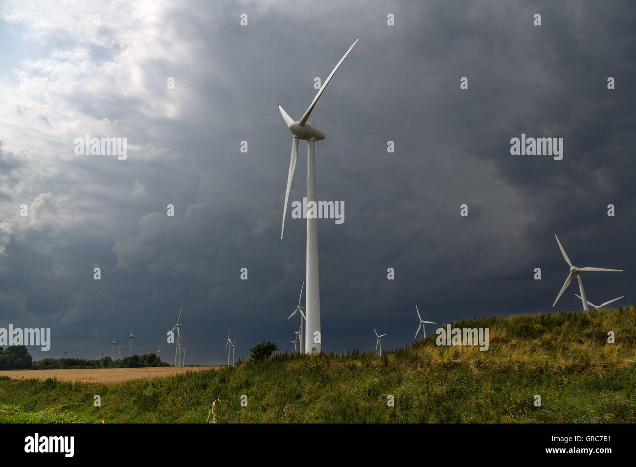 Rain Clouds Over The Wind Turbine Stock Photo - Alamy