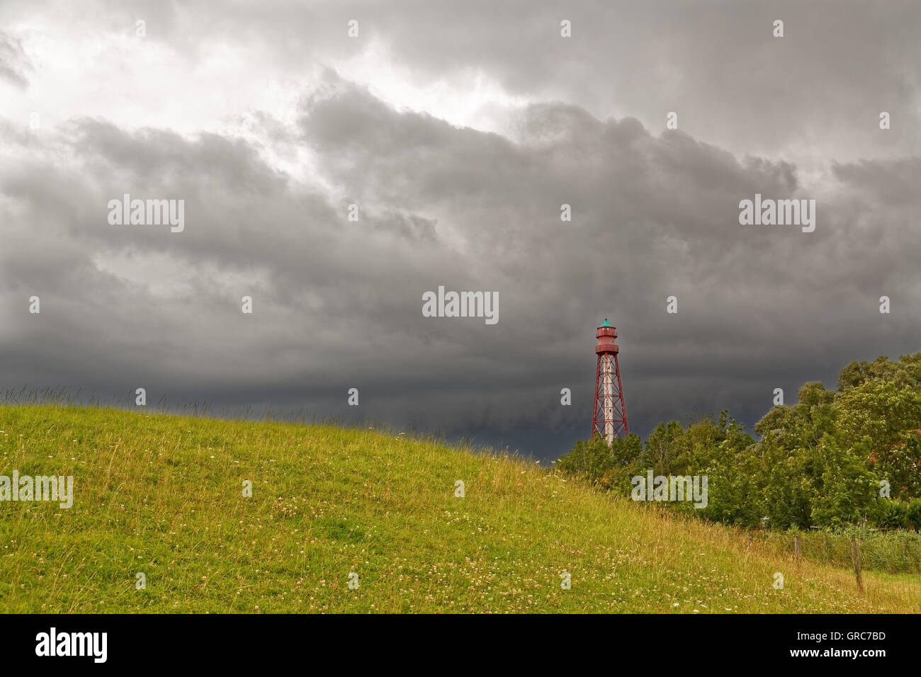 Storm Clouds On Campen Lighthouse Stock Photo - Alamy