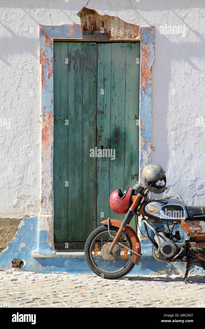 Moped In Front Of A Old House Stock Photo - Alamy