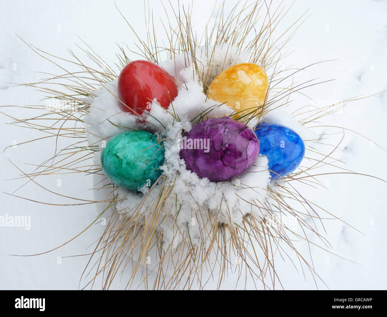 Coloured Easter Eggs Lying In Snow, Symbol Of Easter In Snow Stock ...