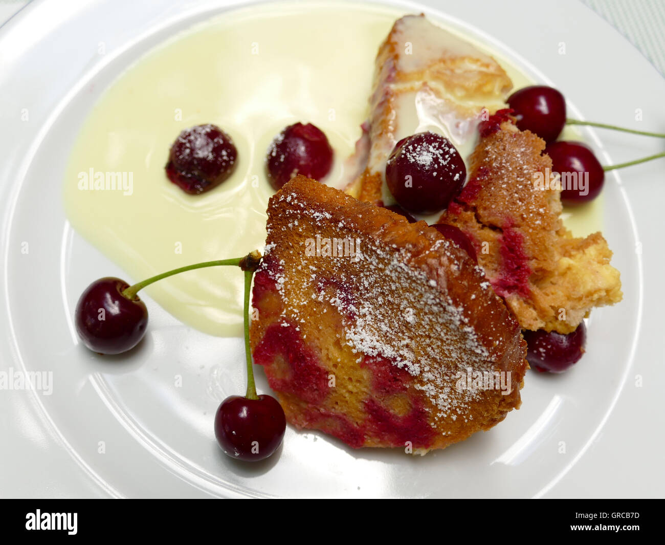 Kirschmichel, Cherry Pudding With Fresh Cherries And Custard Stock ...