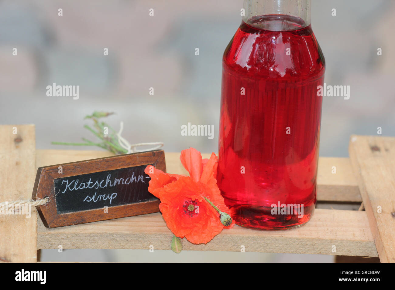 Red Corn Poppy Syrup Homemade Stock Photo - Alamy