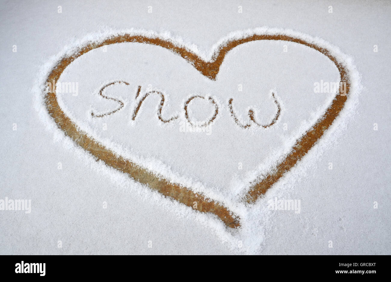 Snow In A Heart Stock Photo - Alamy