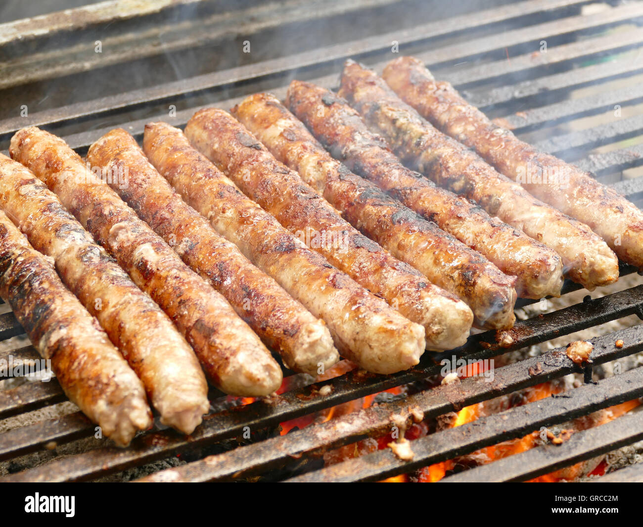 Sausages On A Grill, Barbecue Season Stock Photo - Alamy