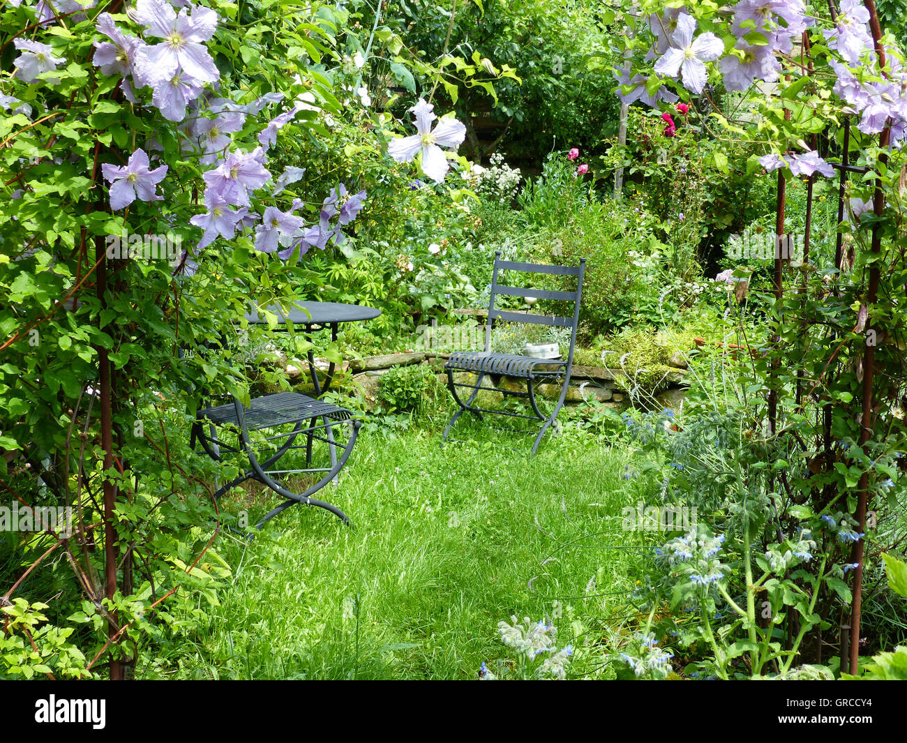 Cozy Place In Romantic Garden Stock Photo - Alamy