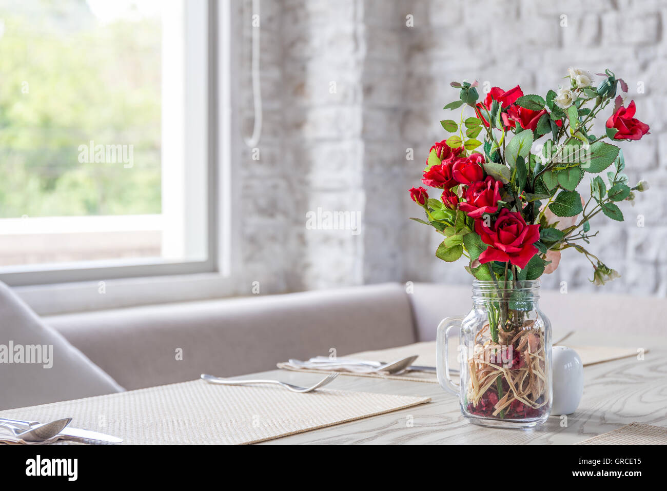 Table setting with rose in restaurant or cafe Stock Photo - Alamy