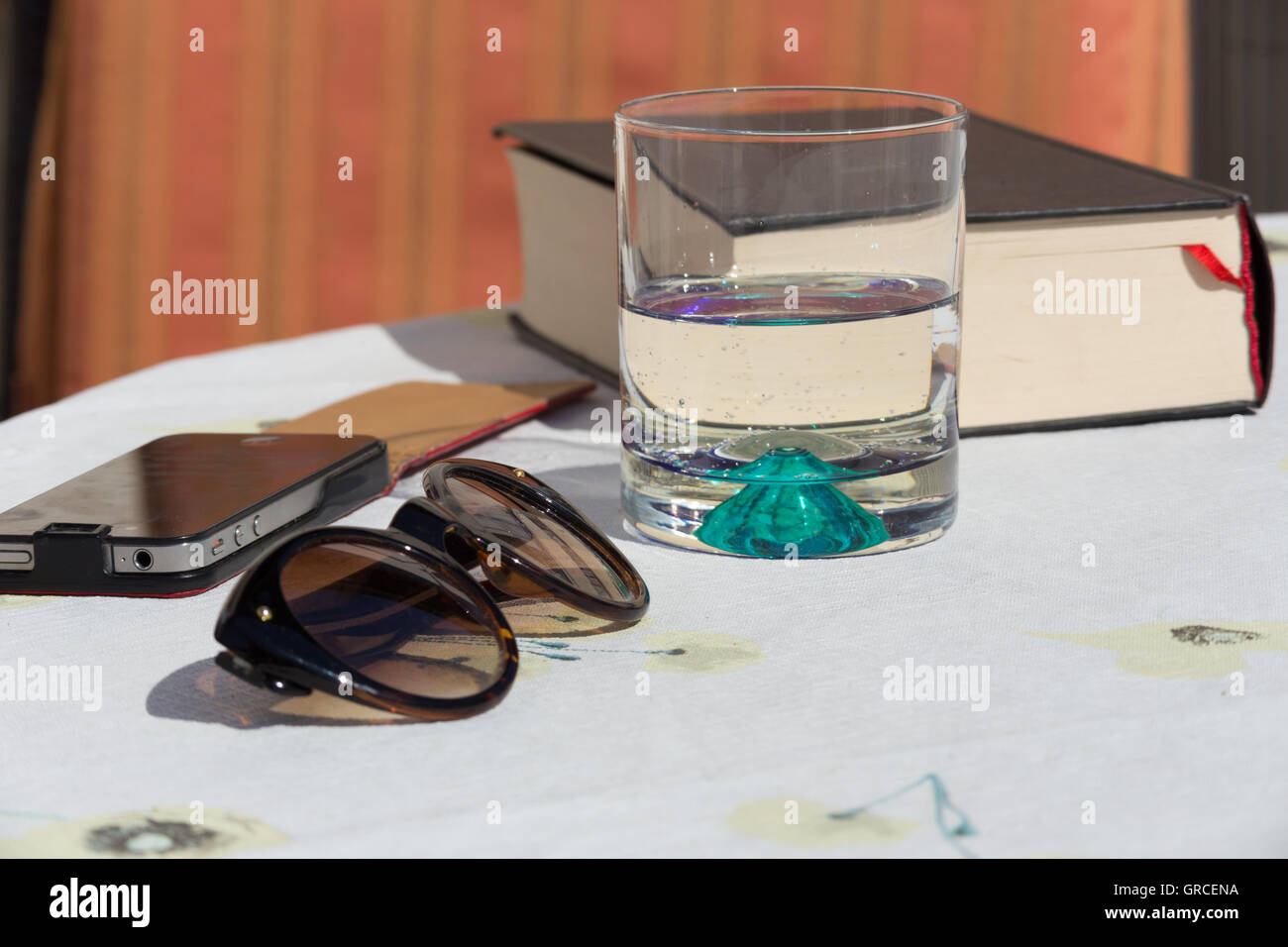 Still Life With Glasses, Glass, Book And Smartphone Stock Photo - Alamy