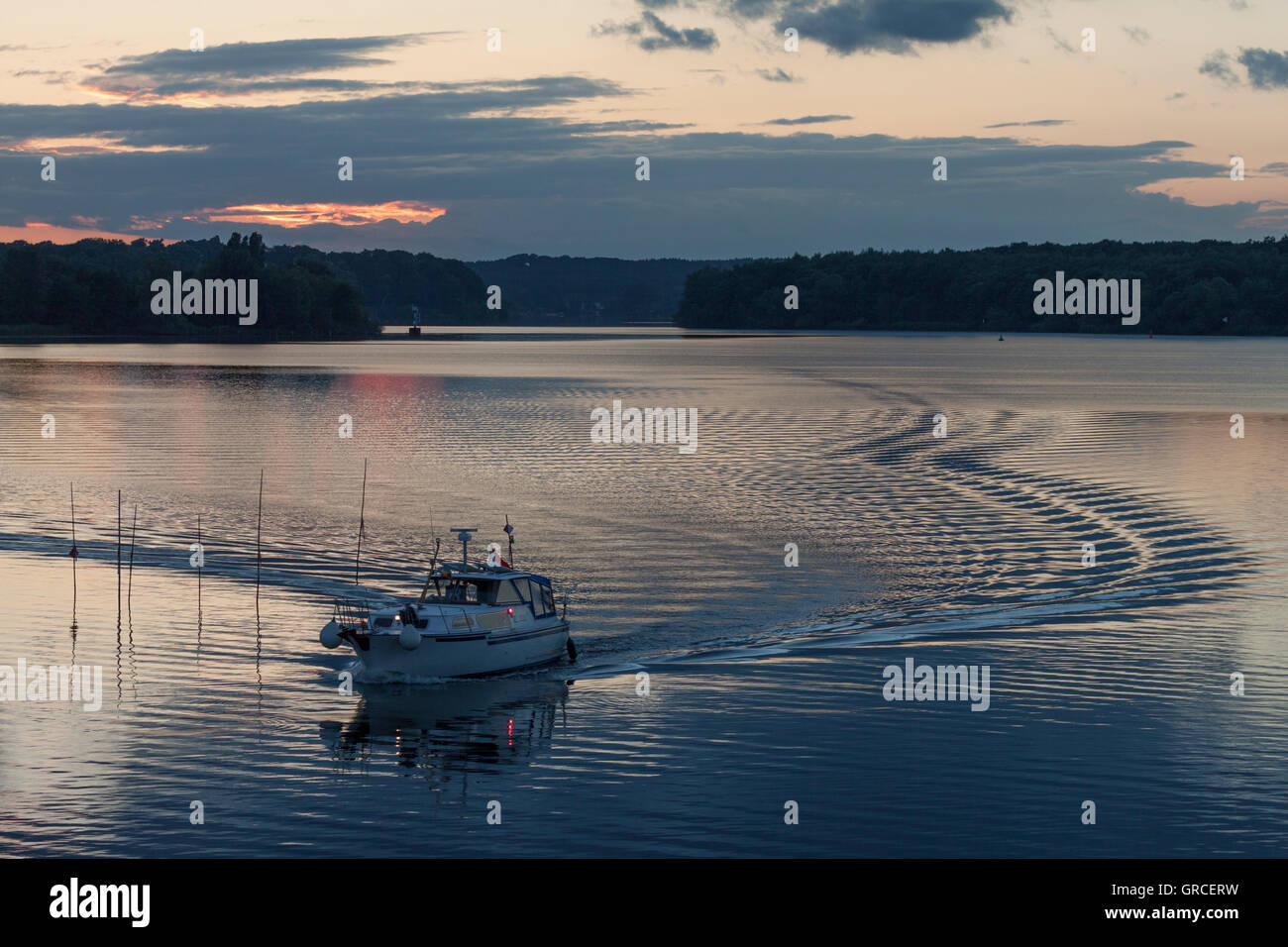 Motorboat With Crooked Wave Trace On The Havel Stock Photo - Alamy