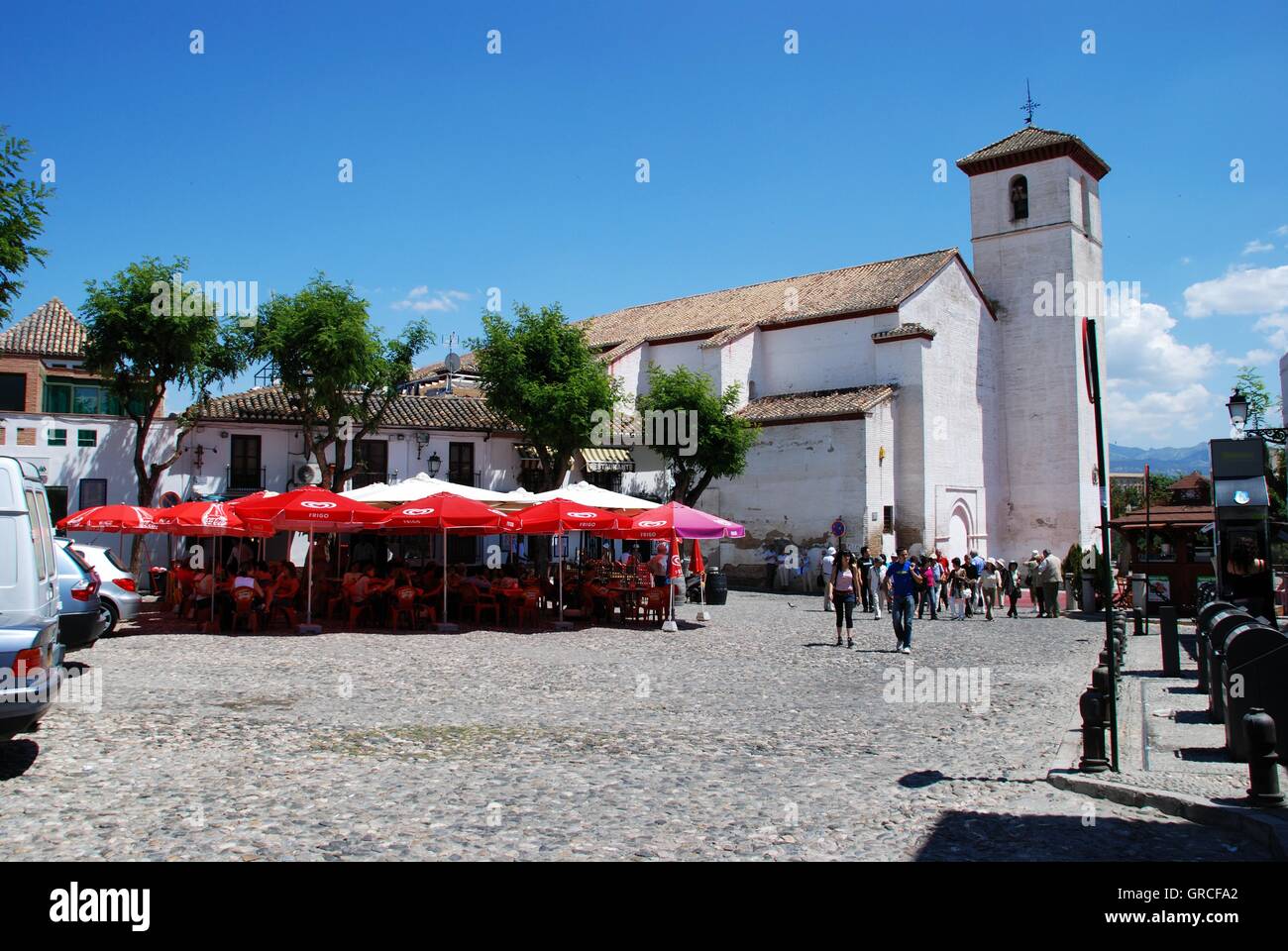 Pavement cafe in the Saint Nicholas plaza with Saint Nicholas church to ...