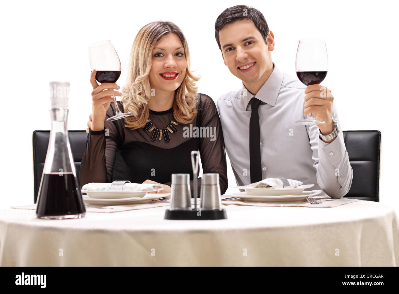 Young man and woman on a date posing together isolated on white ...
