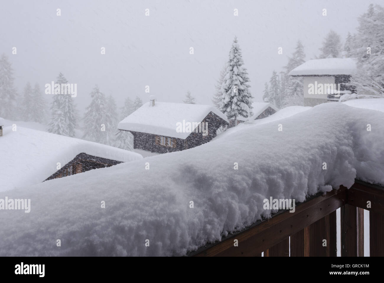Snow Is Falling. In The Foreground Snow Covered Wooden Railing, In The ...