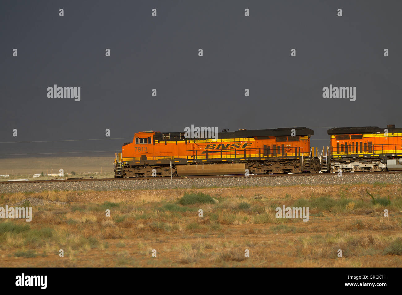 Freight train moving through desert with stormy sky. Nevada USA Stock ...