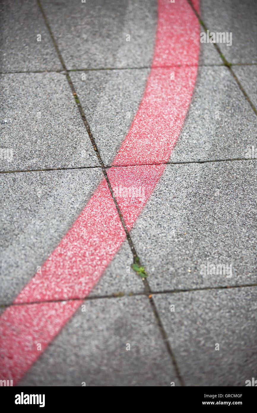 Red Curve Line On Sidewalk Stock Photo - Alamy