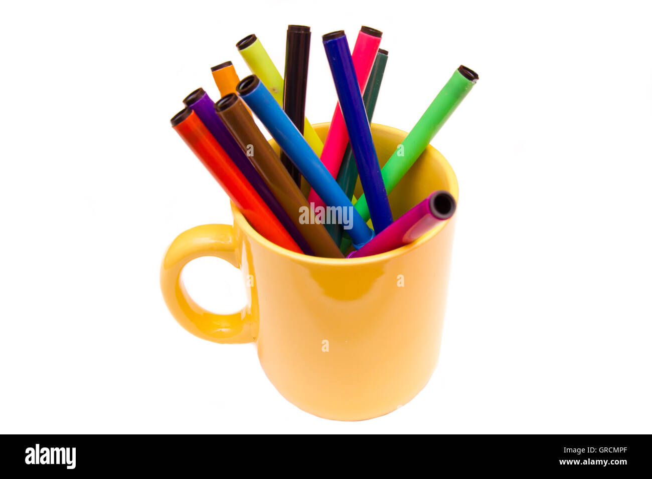 Cup with markers on a white background Stock Photo - Alamy