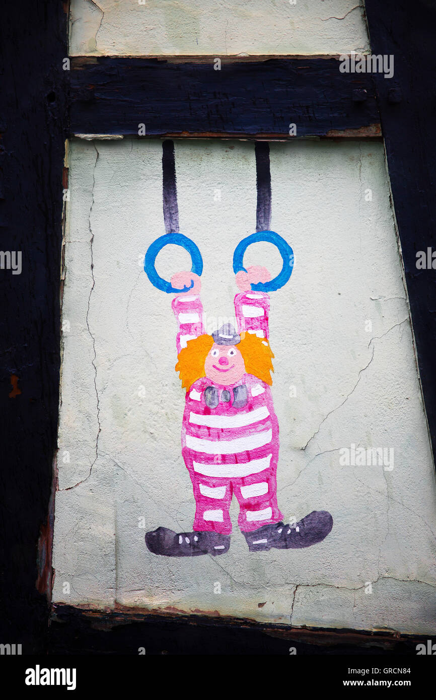 Funny Clown On House Wall Stock Photo - Alamy