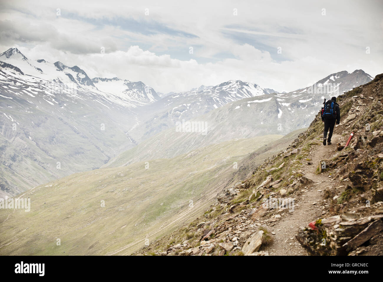 Lonely Hiker On Mountain Path Stock Photo - Alamy