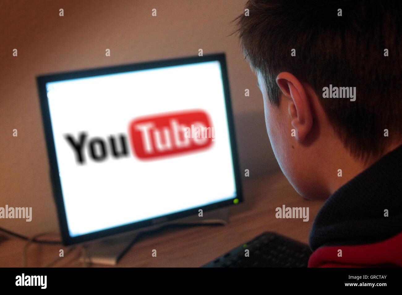 Teenager Surfing On The Web And Using Youtube Stock Photo - Alamy