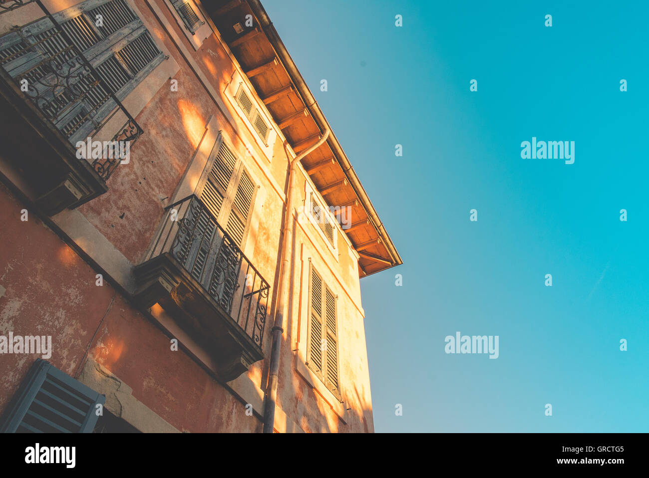 Facade of an old house at sunset Stock Photo - Alamy