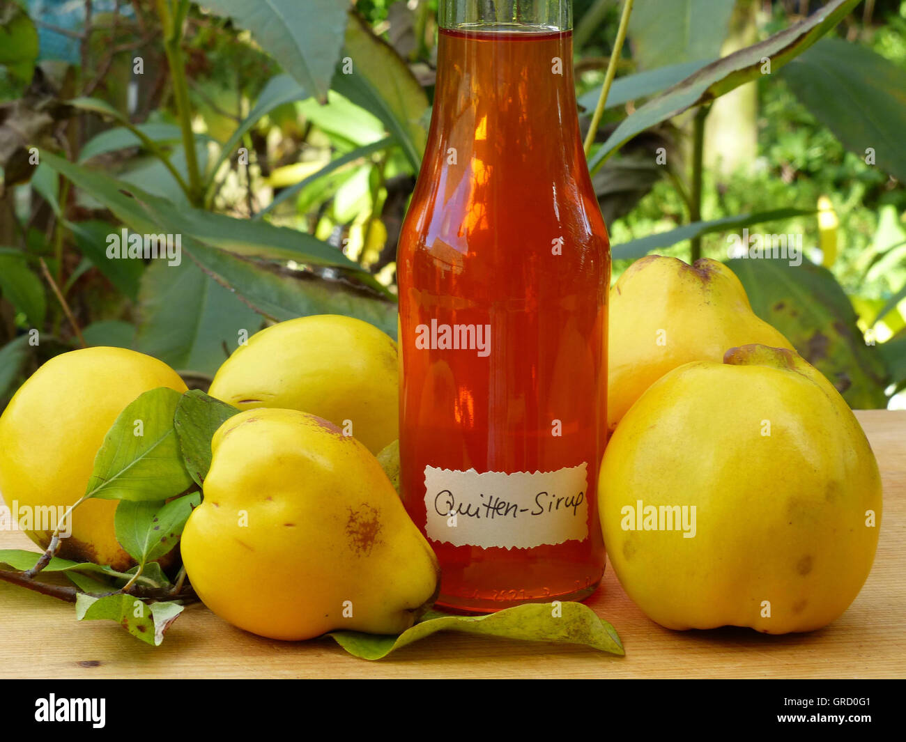 Quince Syrup Handmade, And Some Quinces Stock Photo - Alamy