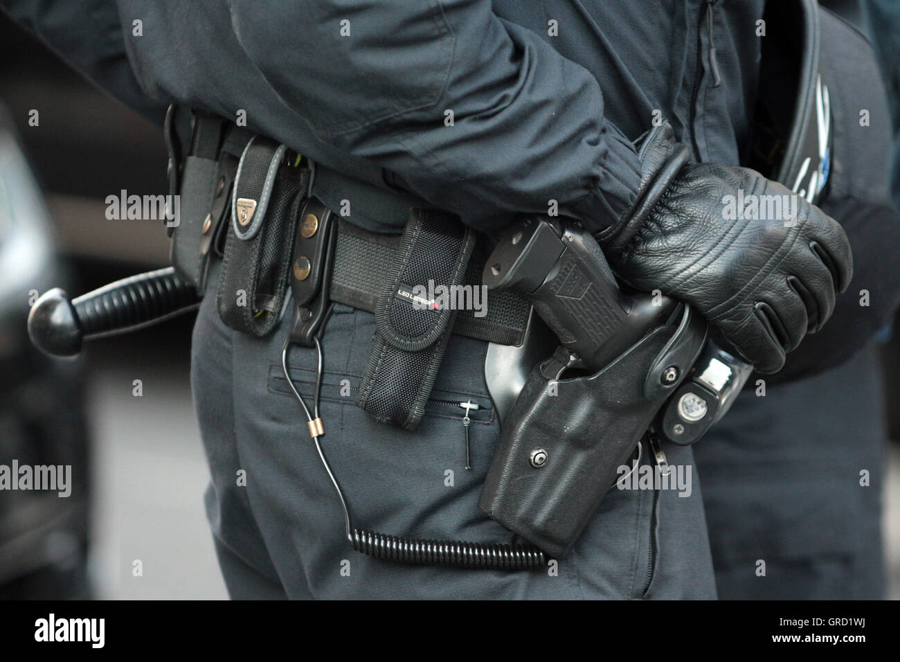 Policeman in uniform baton hi-res stock photography and images - Alamy