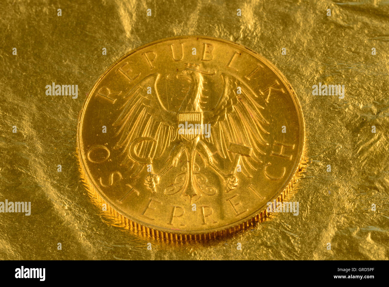 25 Austrian Schilling Gold Coin With Golden Background Stock Photo - Alamy
