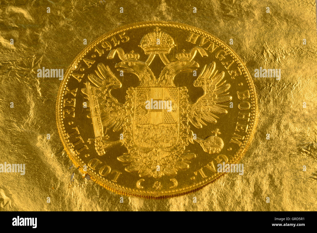 Austrian Gold Ducat With Gold Background Stock Photo - Alamy