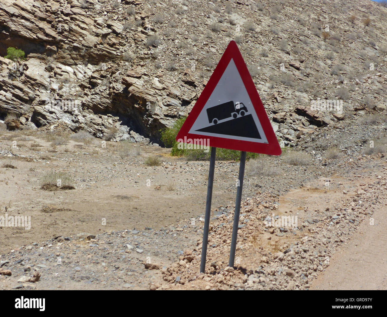 Road Sign Warning Dangerous Slope Stock Photo - Alamy