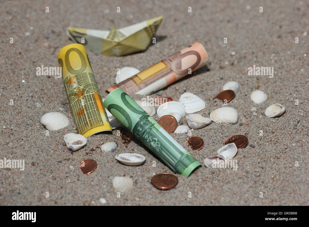 Money, Banknotes, Coins And Shells In The Sand, Symbolizing Vacation ...