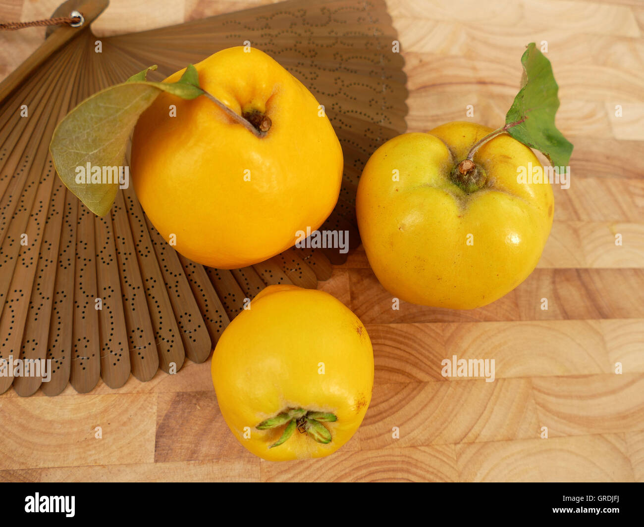 Three Ripe Quinces Stock Photo - Alamy