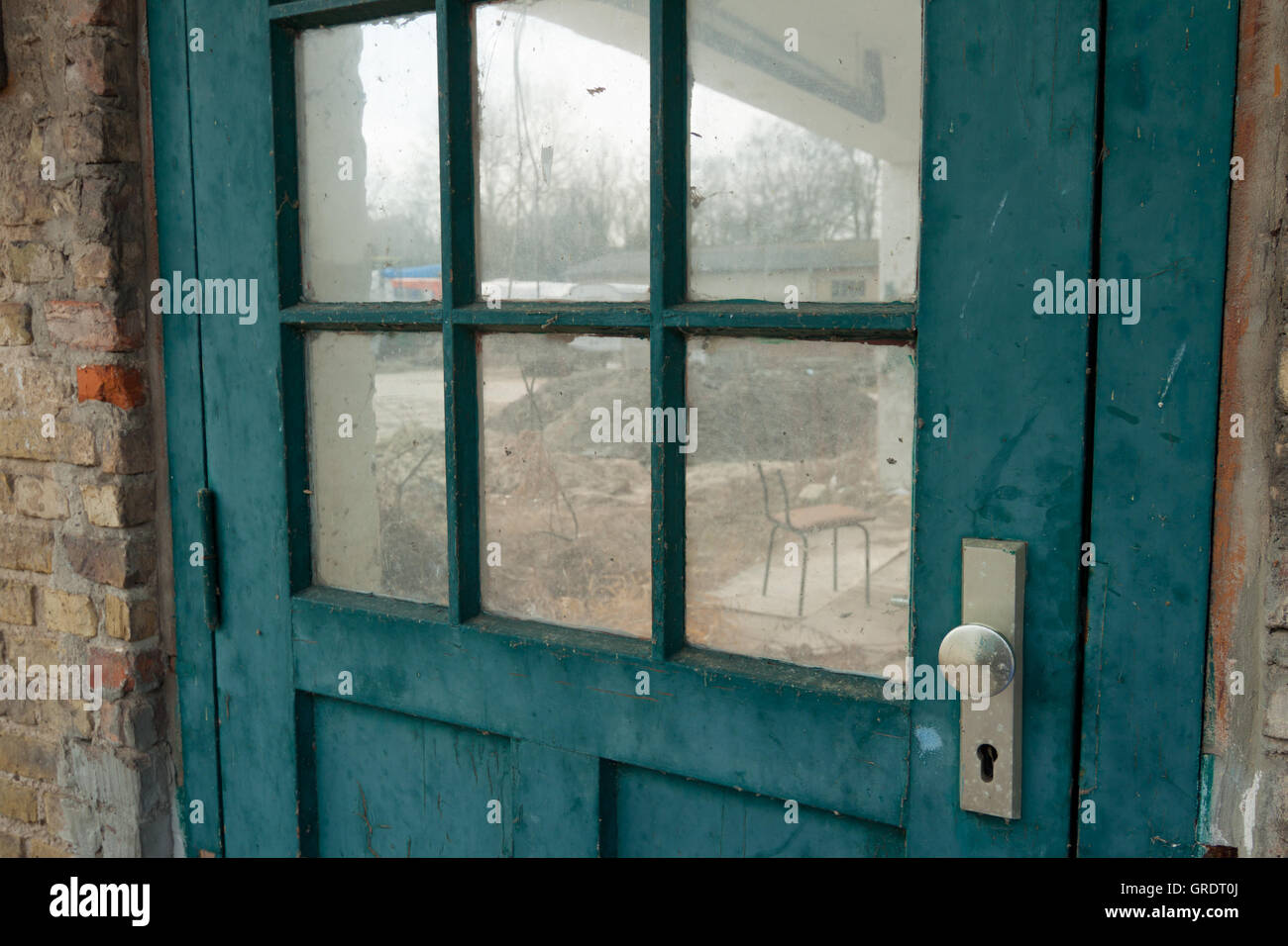 Green Door On A Condemned Building On A Construction Site Stock Photo ...