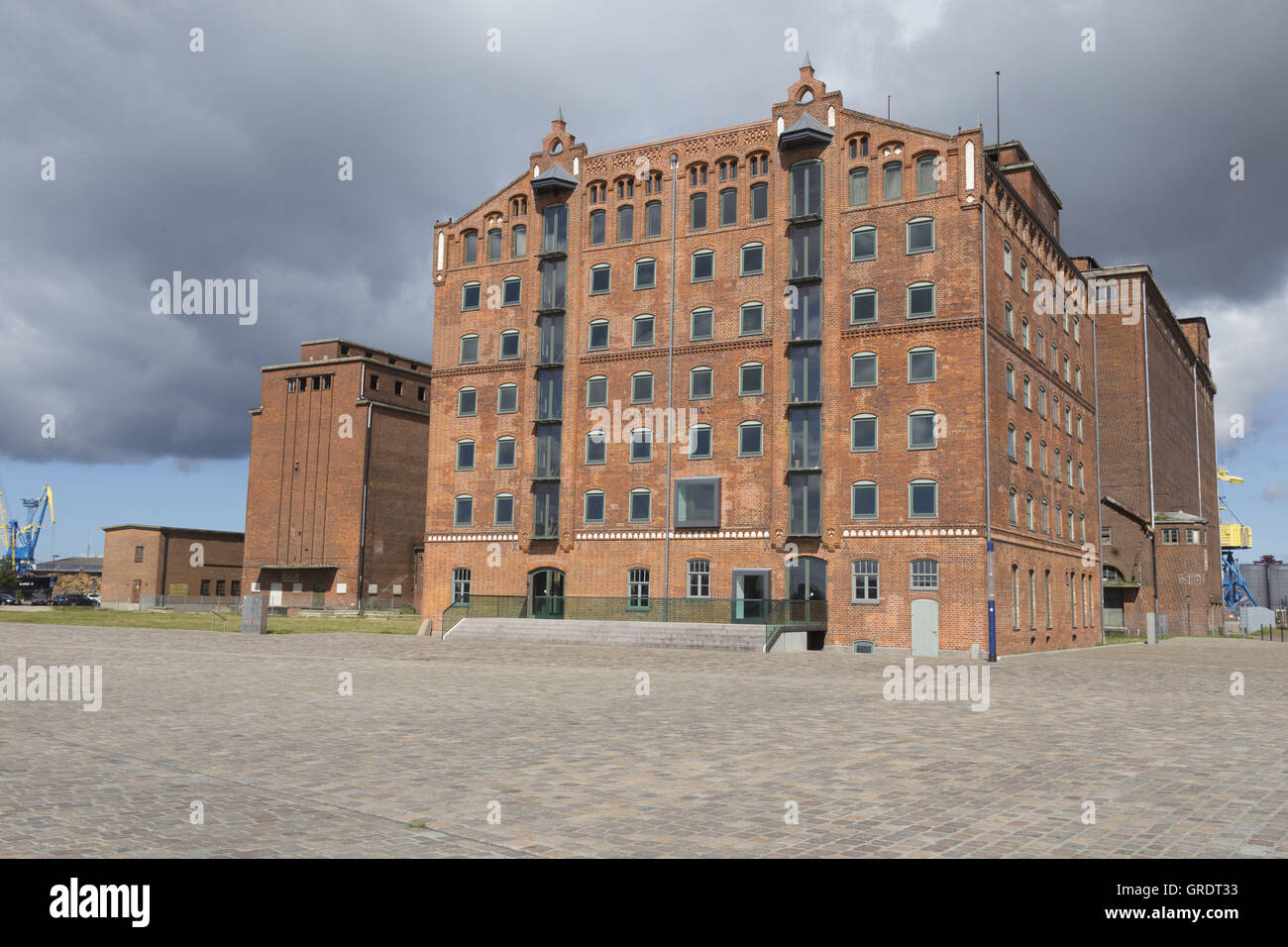 Big, Old Harbor Warehouse Brick Building With Many Windows In The Port ...