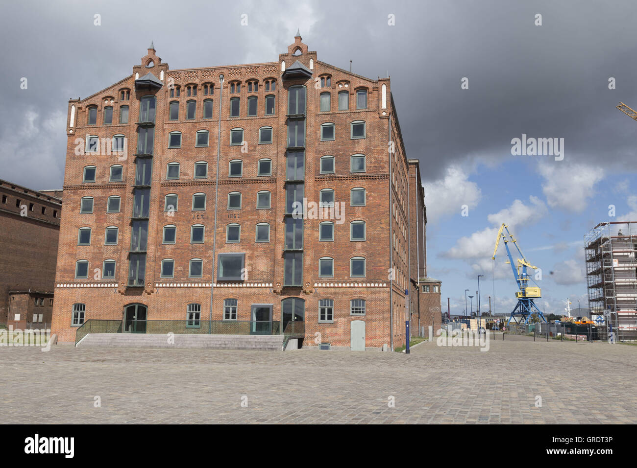Big, Old Harbor Warehouse Brick Building With Many Windows In The Port ...