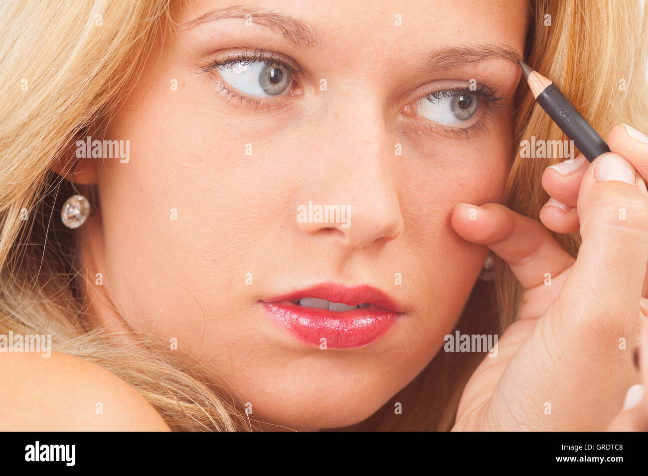 Young Woman Extends Her Eyebrows With The Stylus Stock Photo - Alamy