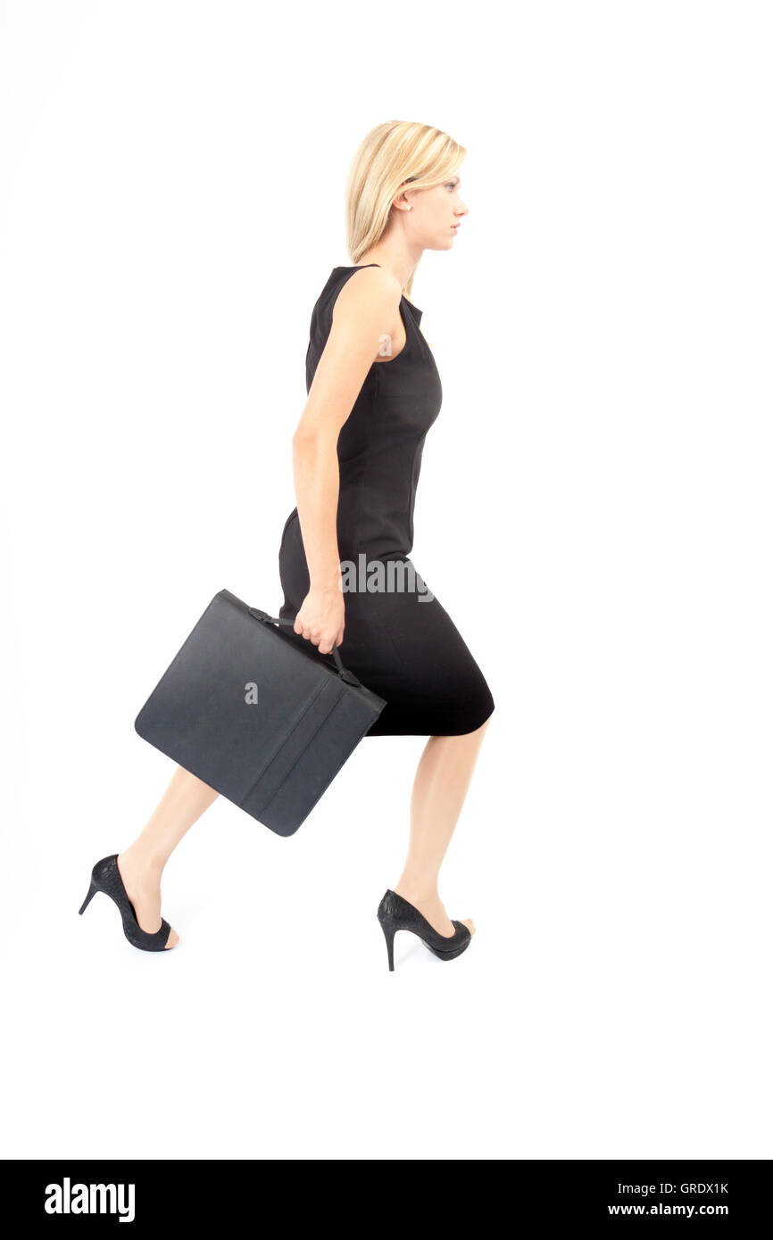 Young Woman With Briefcase Running To The Right Stock Photo - Alamy