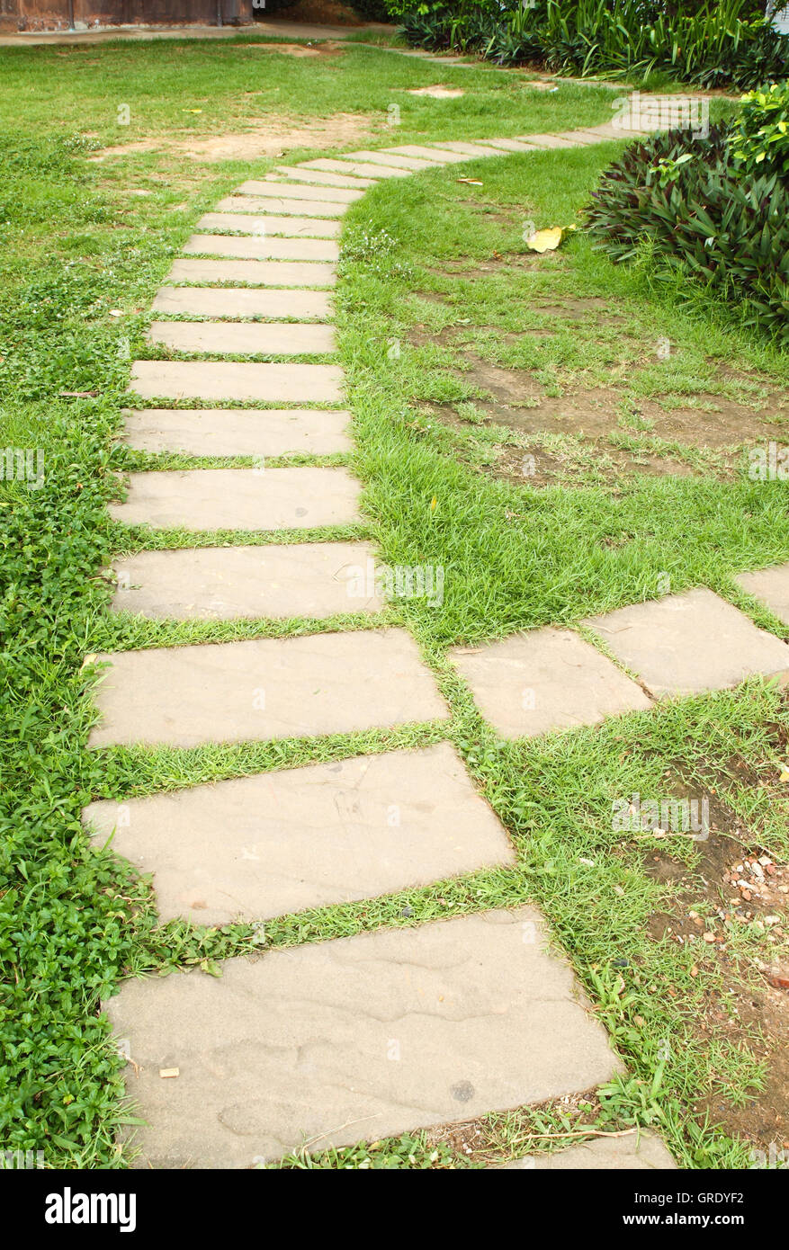 Stone block walk path in the park Stock Photo - Alamy