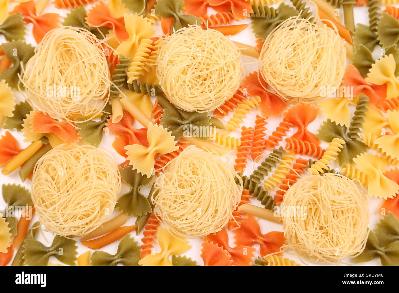 different pasta in three colors close-up Stock Photo - Alamy