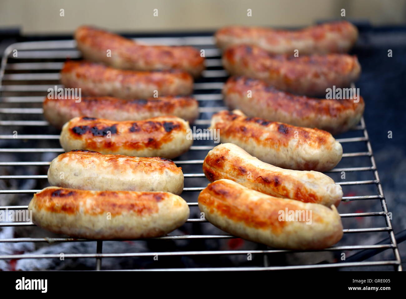 Sausages on grill Stock Photo - Alamy