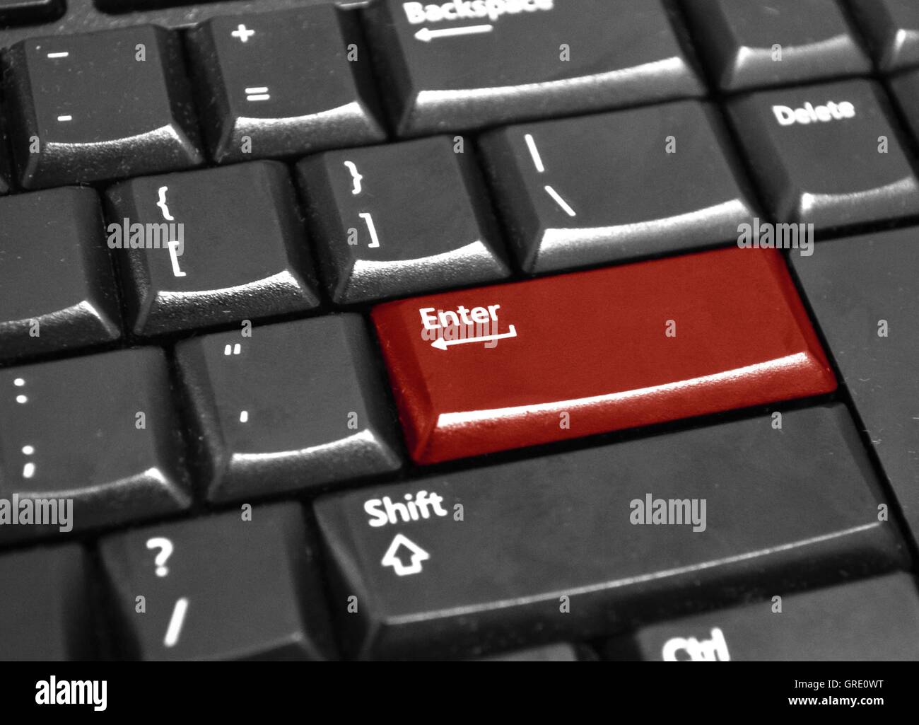 Keyboard with red Enter key Stock Photo - Alamy