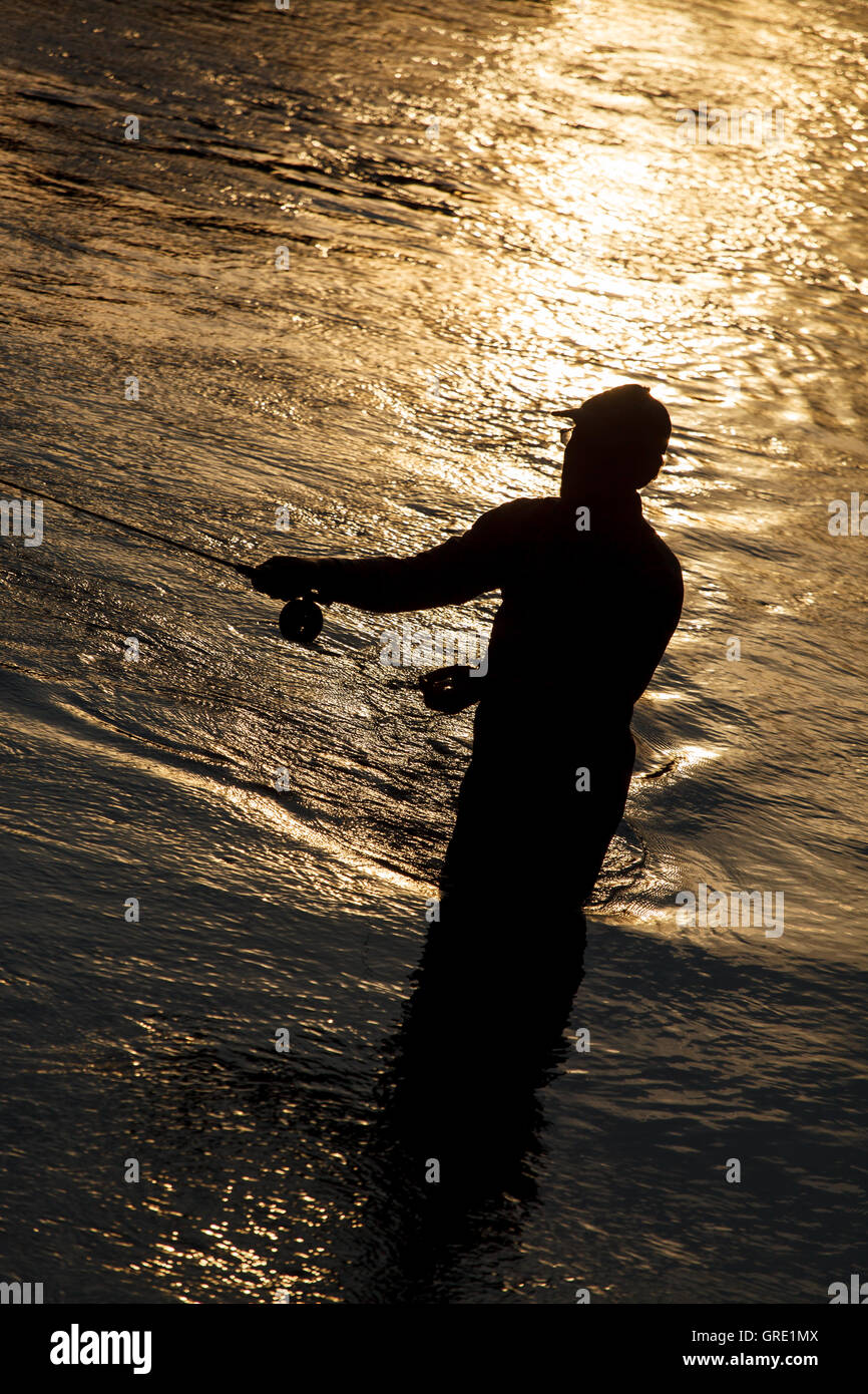 Black man catching fish hi-res stock photography and images - Alamy