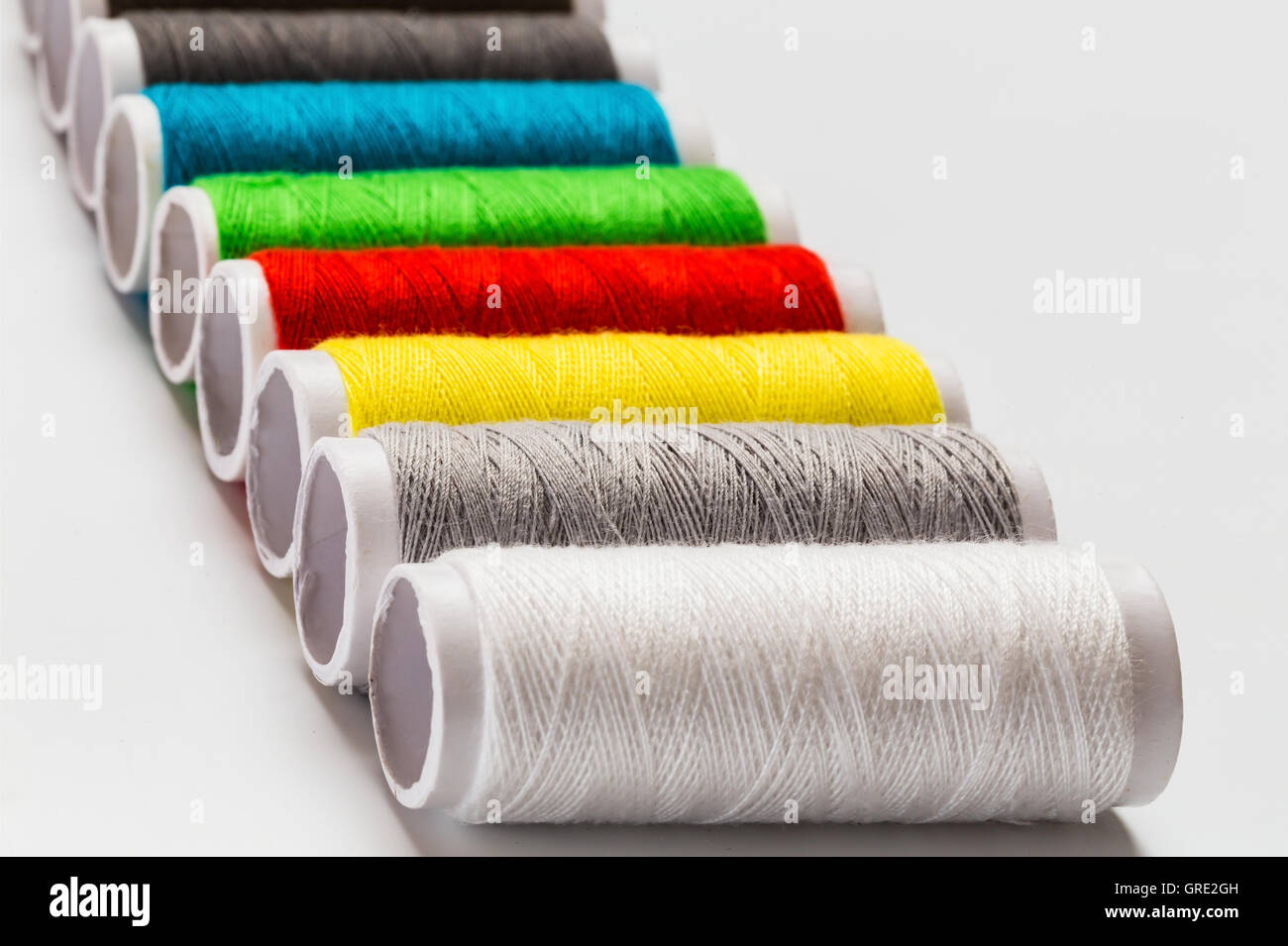 close up colorful thread bobbin Stock Photo - Alamy